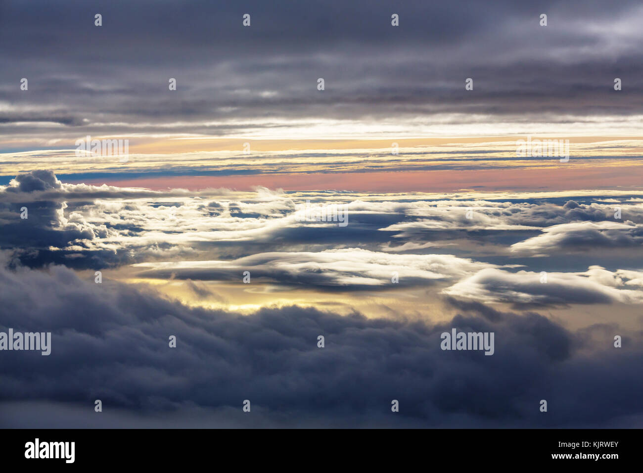 Beautiful view above clouds from the aircraft Stock Photo - Alamy
