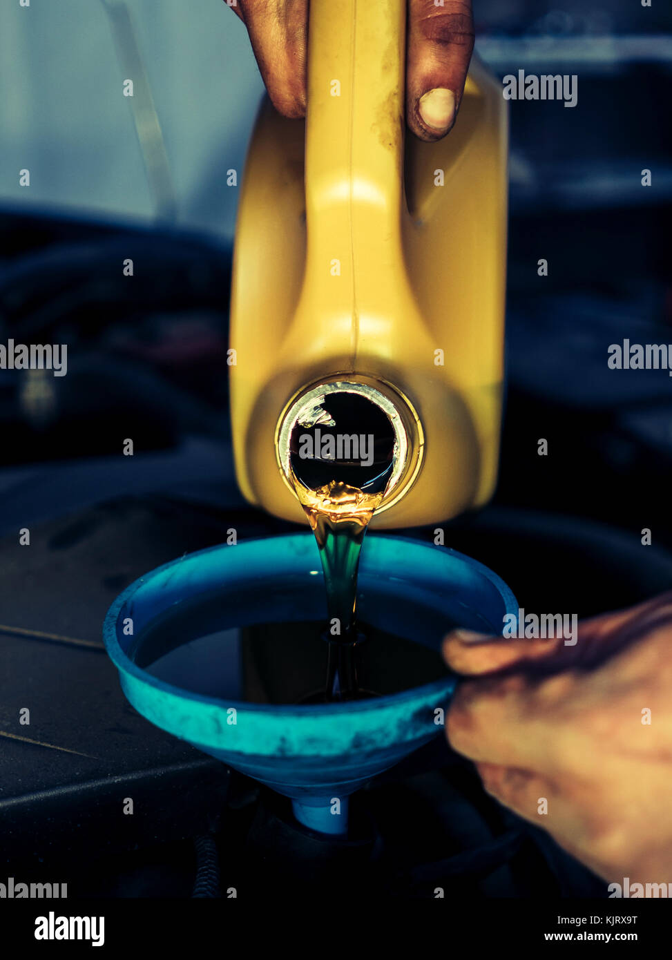 Man pouring oil into engine hi-res stock photography and images - Alamy