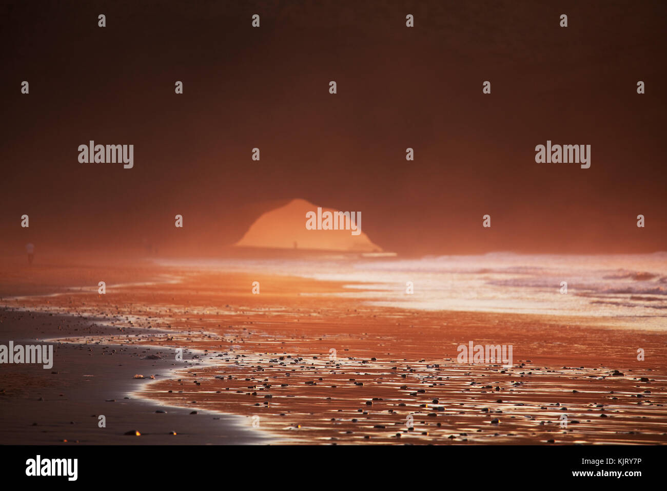 Arch rock formation on the beach, Morocco Stock Photo - Alamy