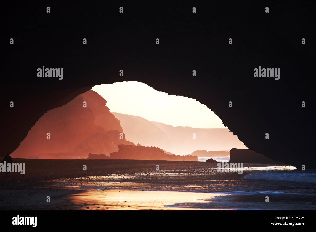 Arch rock formation on the beach, Morocco Stock Photo - Alamy