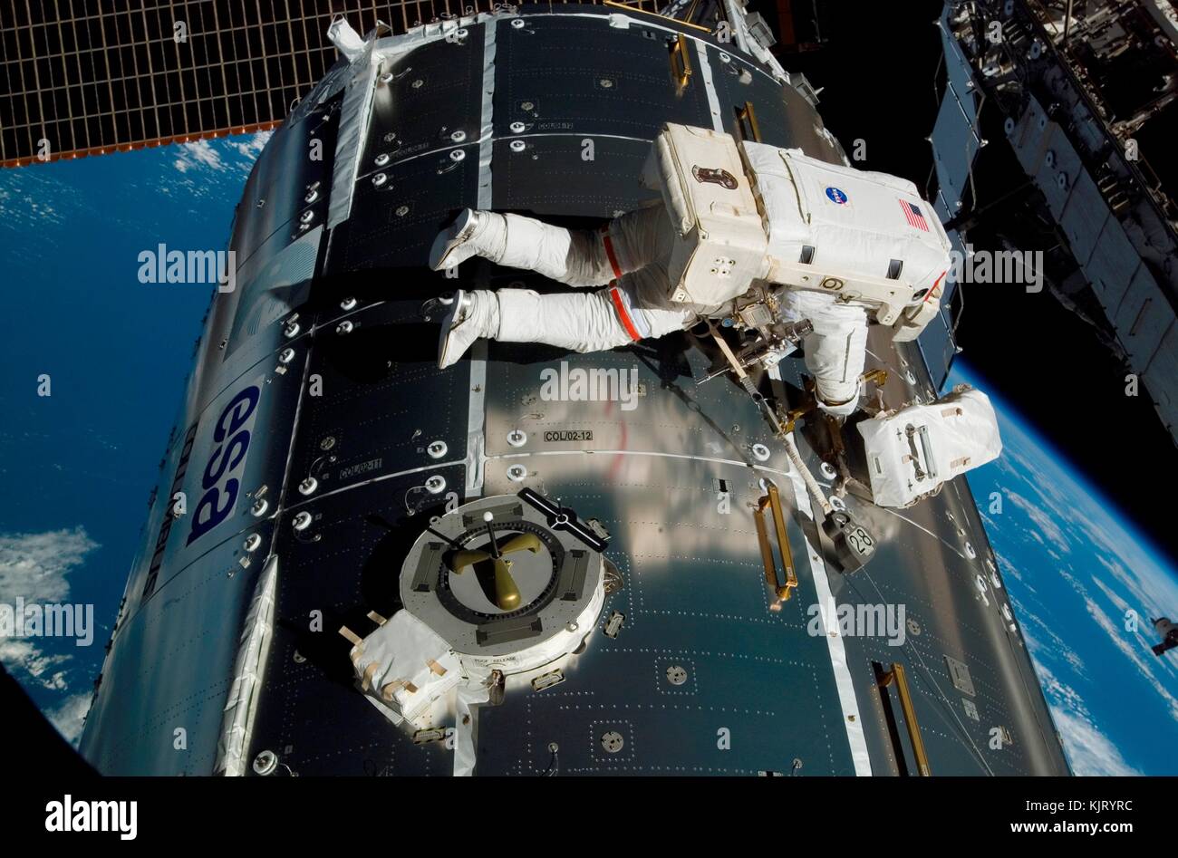NASA STS-122 mission prime crew astronaut Rex Walheim works on the ...