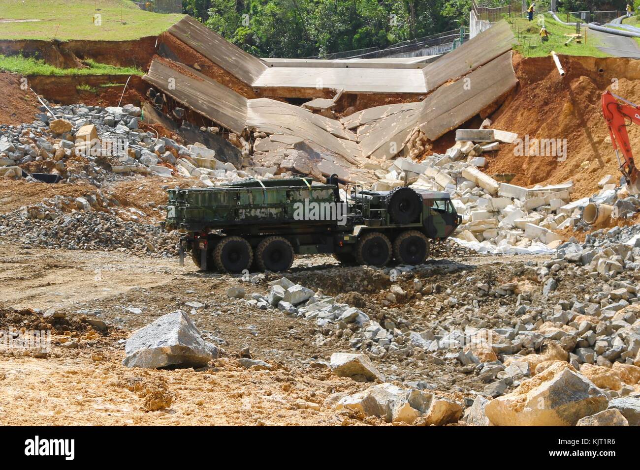 U.S. National Guard soldiers repair a fissure at the Guajataca Dam ...