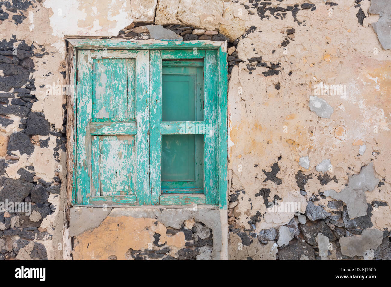 A closed old turquoise window frame in a vintage wall Stock Photo - Alamy