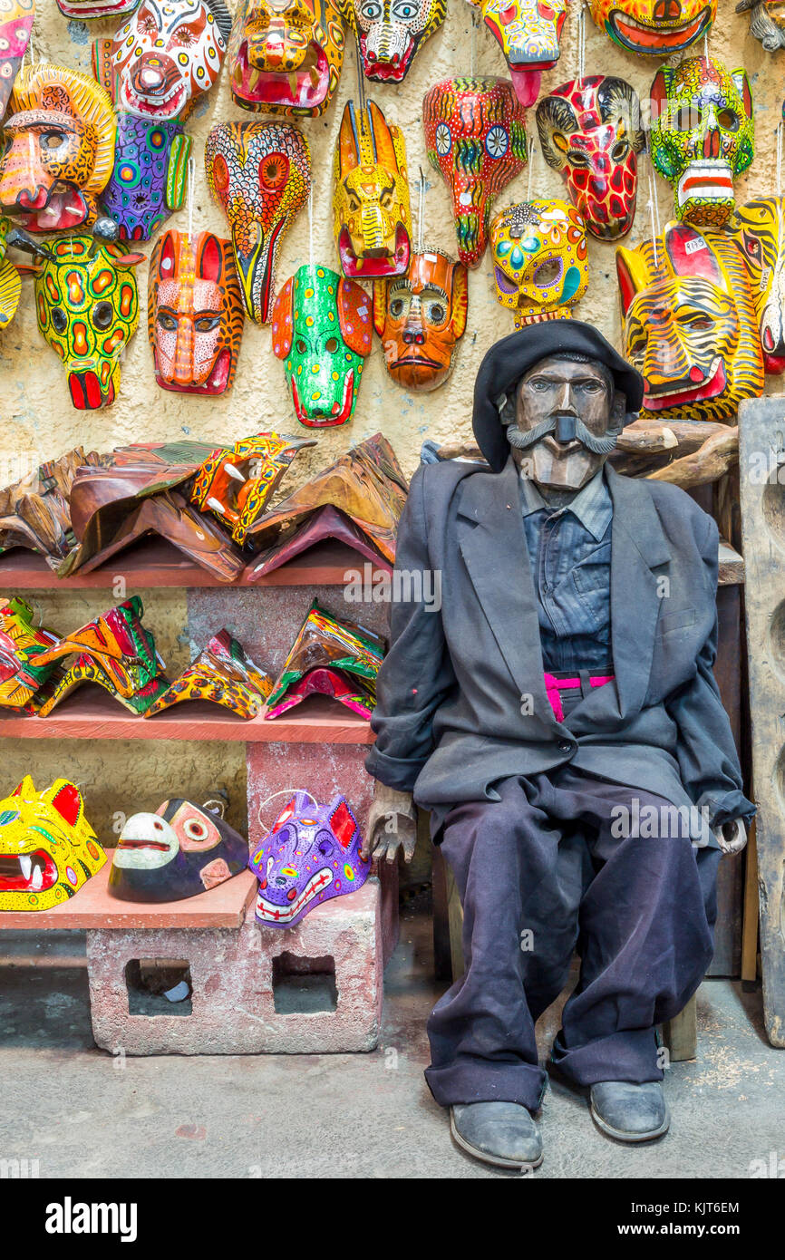 Traditional masks and the mayan deity Maximón in a souvenir shop ...