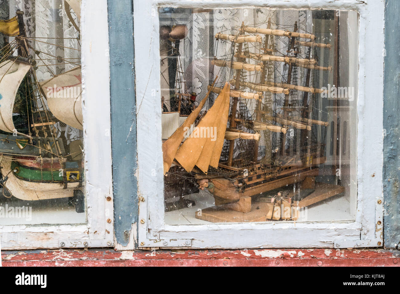 Models of ancient ships and boats behind old window Stock Photo - Alamy