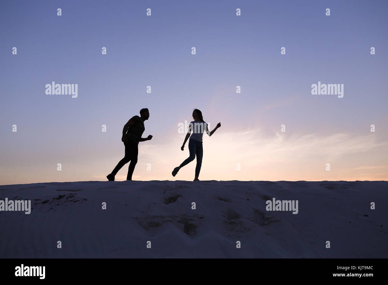 Two lovers of heart, guy and girls are having fun and running th Stock ...