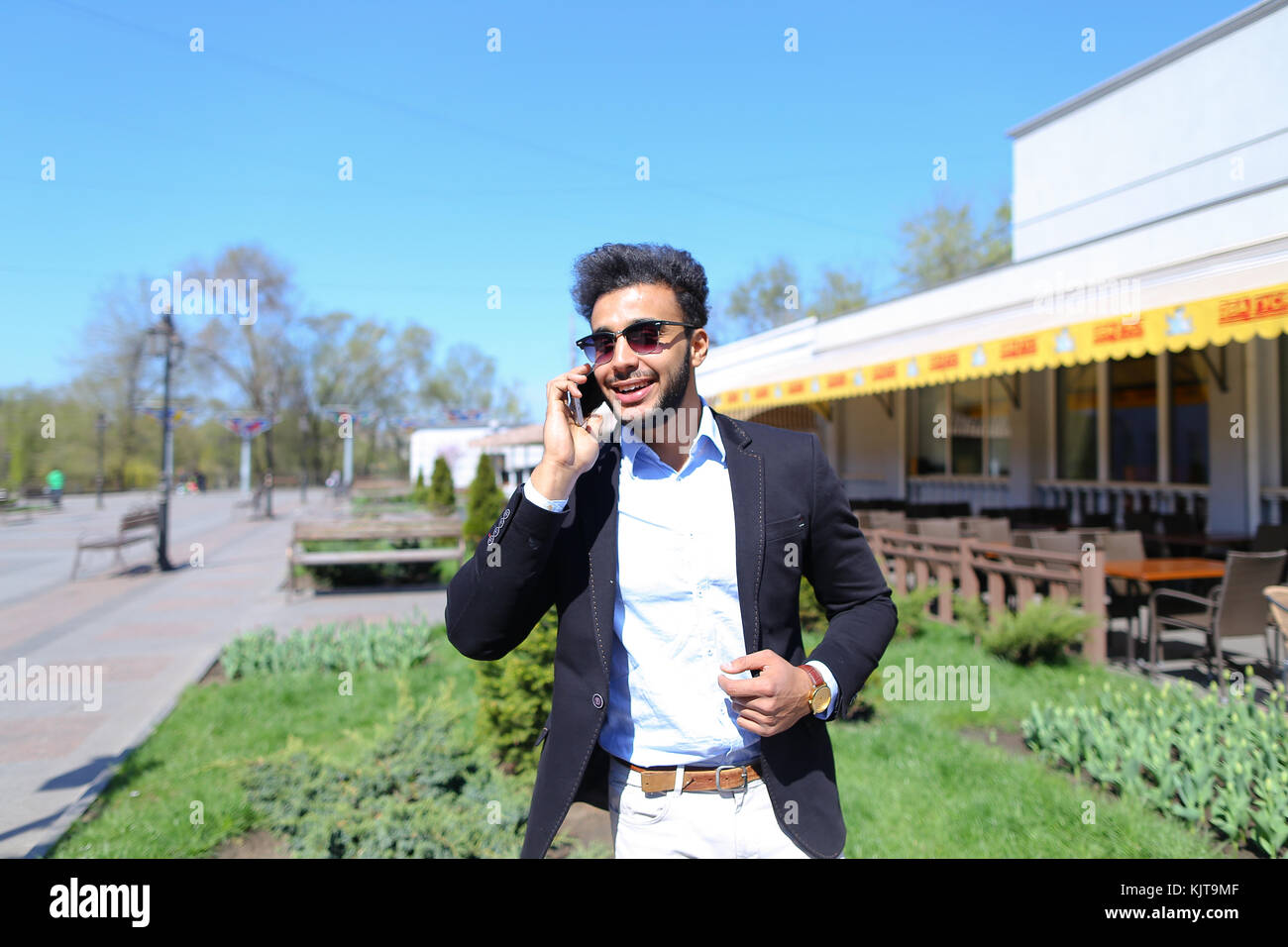 Italian boy telling jokes to wife by phone Stock Photo - Alamy