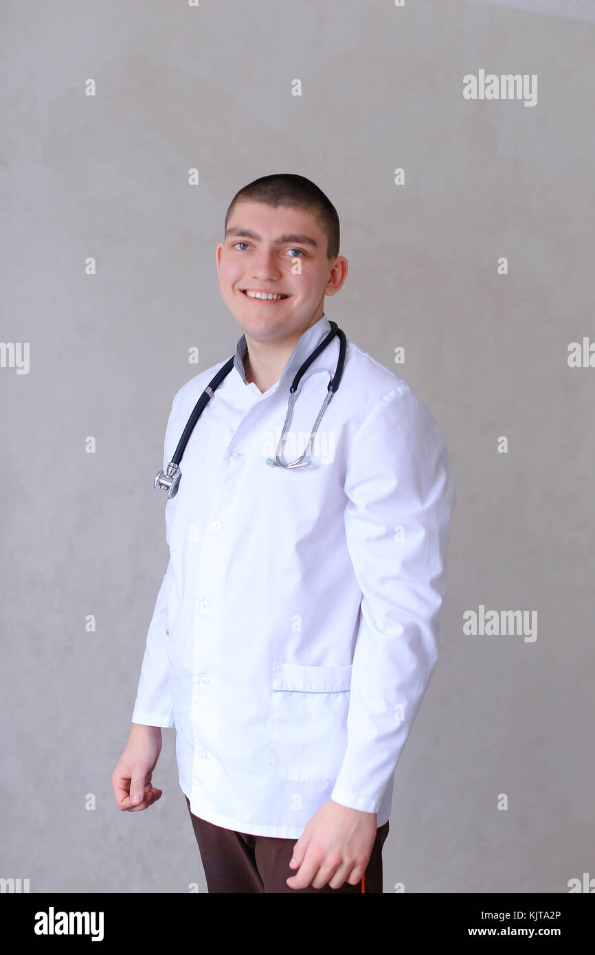 Professional male therapist looks at camera with smile and stand Stock ...