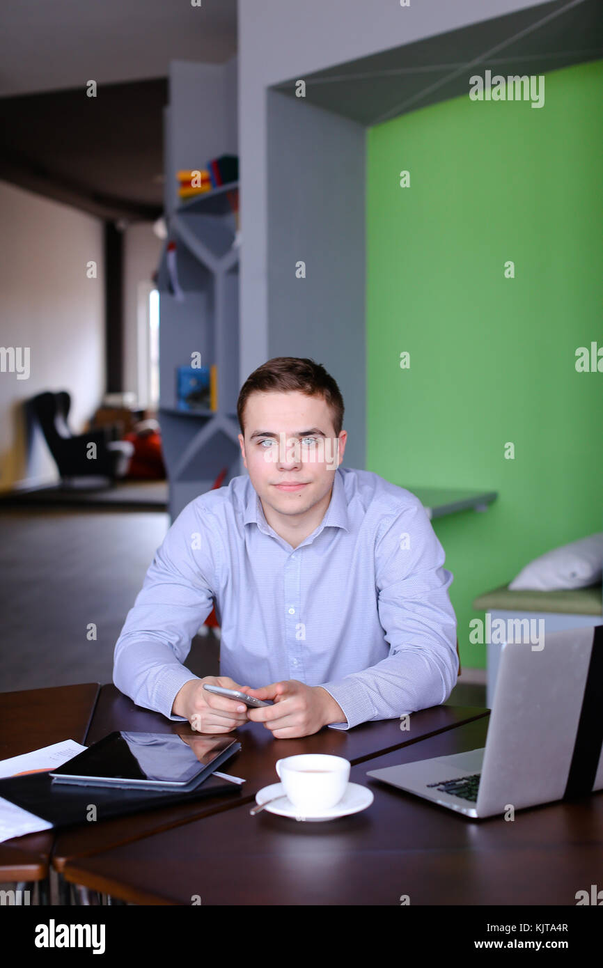 Portrait of successful young male businessman who posing and loo Stock ...