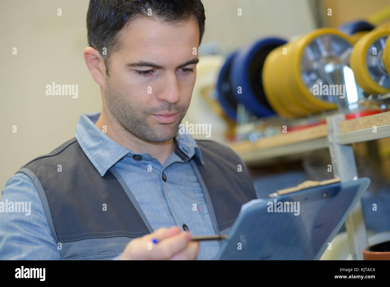 engineer working in a warehouse Stock Photo - Alamy