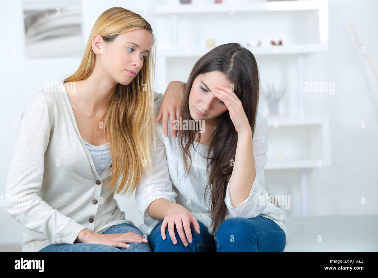 friend comforting sorrowful young female teenager Stock Photo ... friend comforting sorrowful young female teenager Stock Photo ...