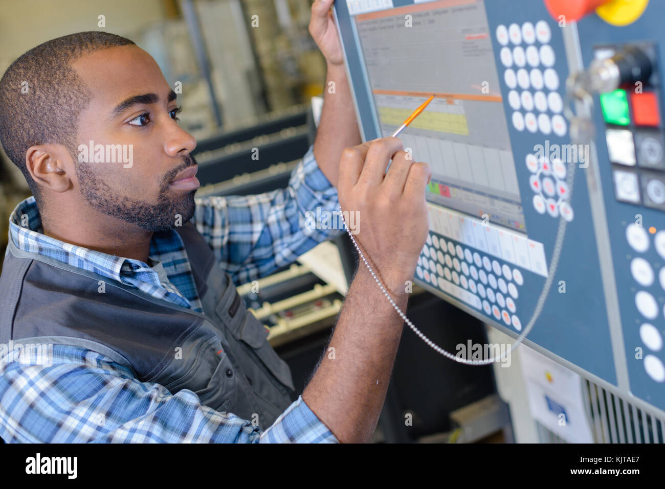 Man operating industrial computer with stylus Stock Photo - Alamy