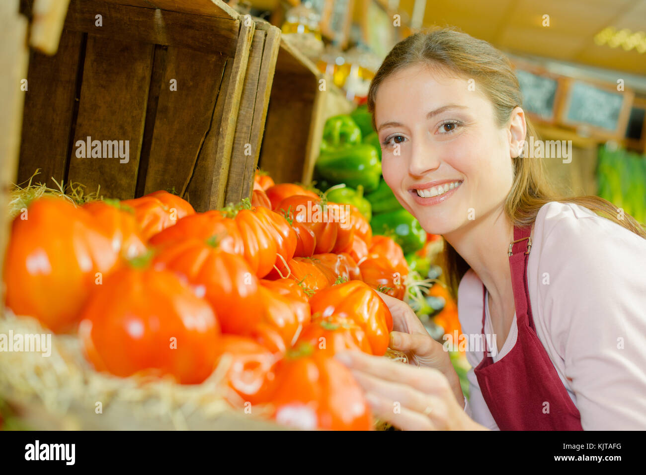 girl posing with tomatoes Stock Photo - Alamy