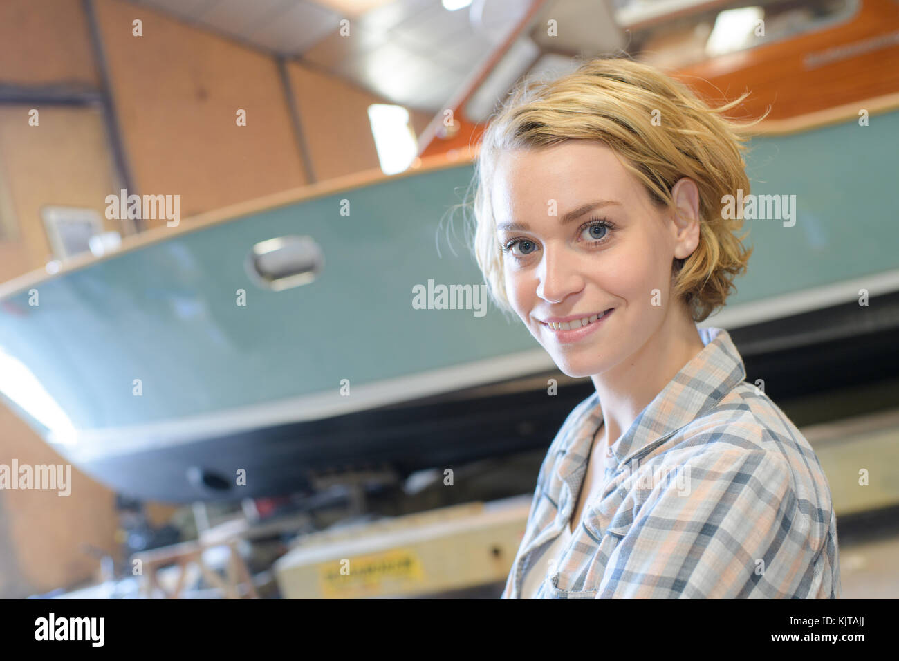 beautiful female marine builder in the shed Stock Photo - Alamy