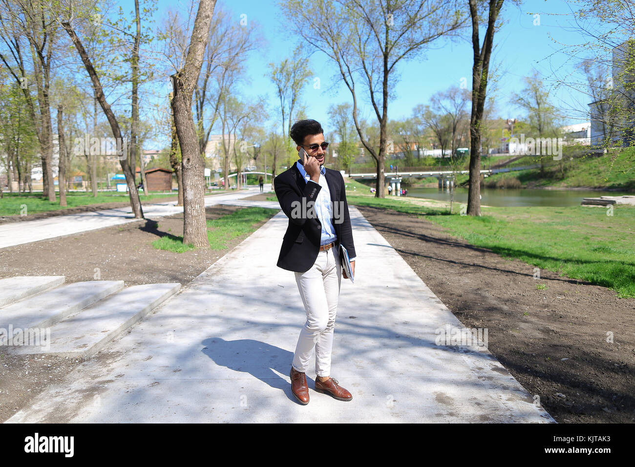 Arabian walking in park and smiling in slow motion Stock Photo - Alamy