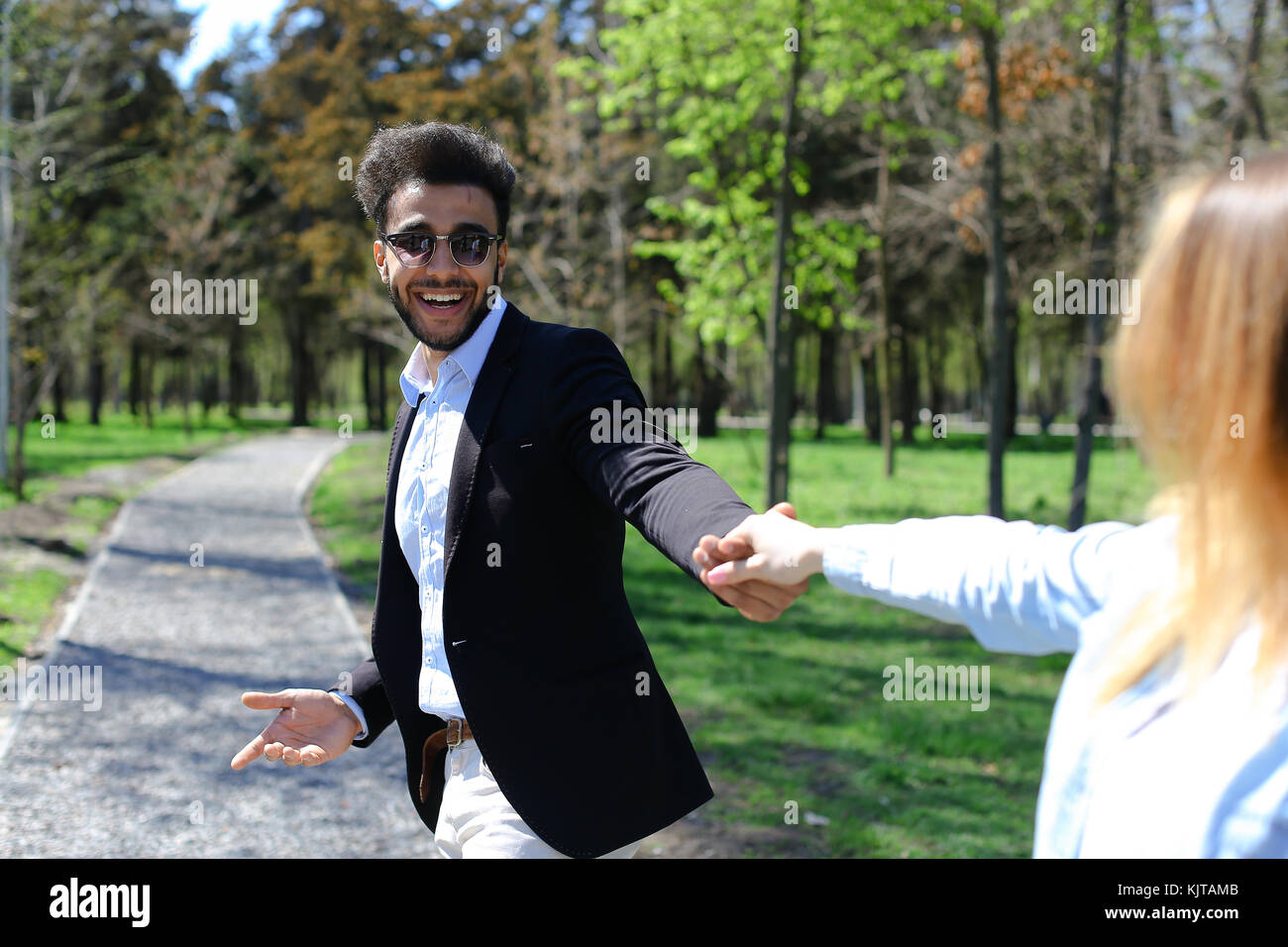 guy leading aunt for walk in park Stock Photo - Alamy