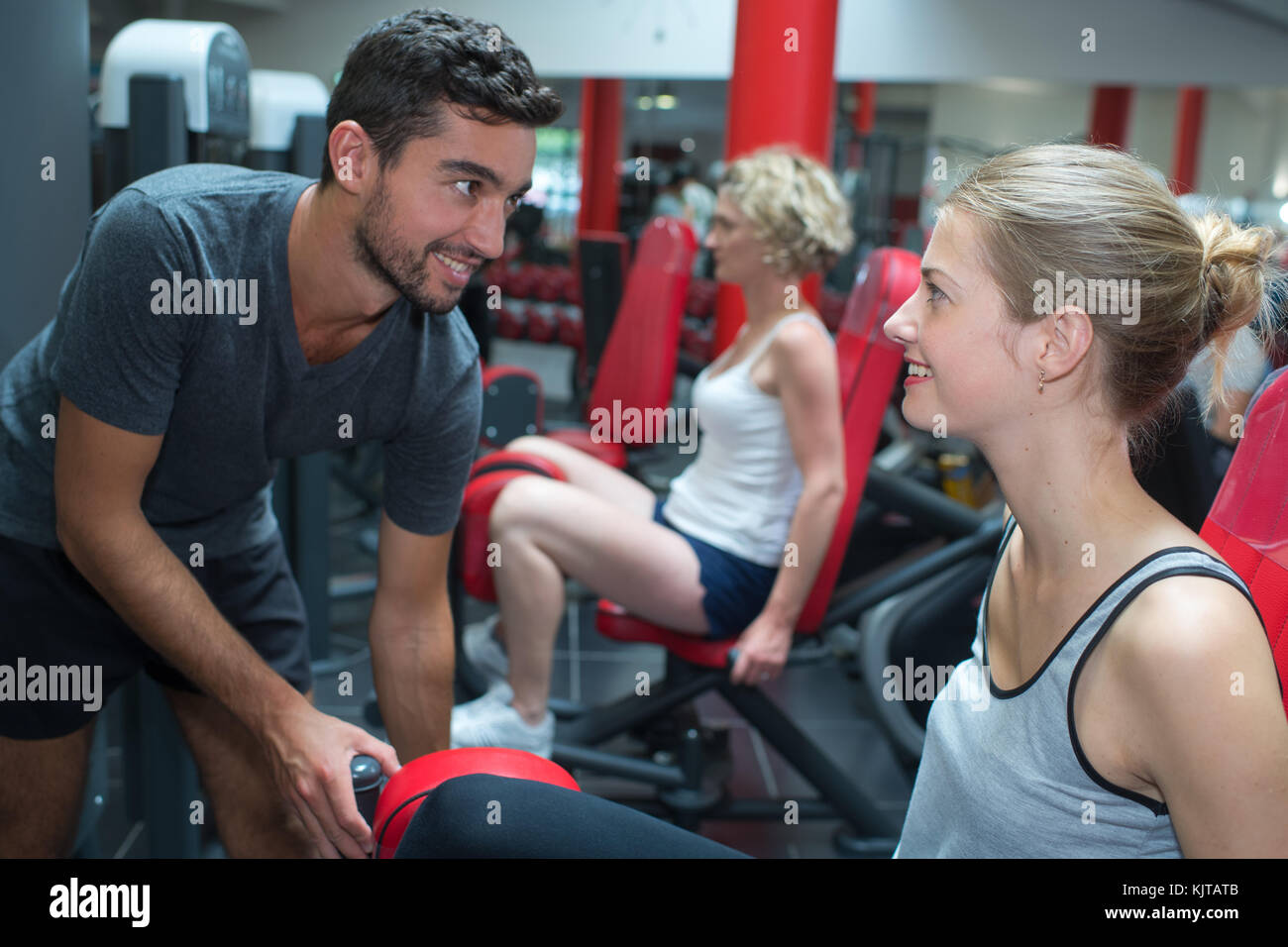 personal trainer working with his client in gym Stock Photo - Alamy
