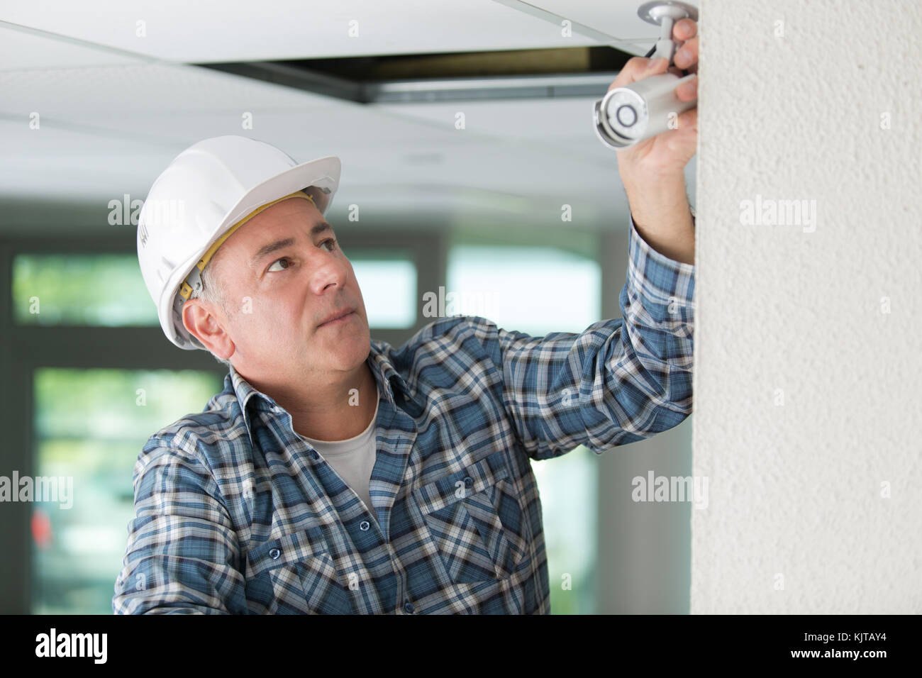 professional cctv technician working Stock Photo - Alamy