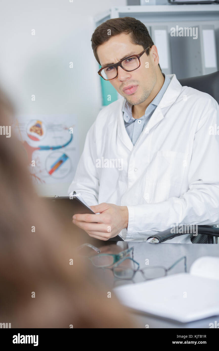 Doctor patient discussing something in hi-res stock photography and ...
