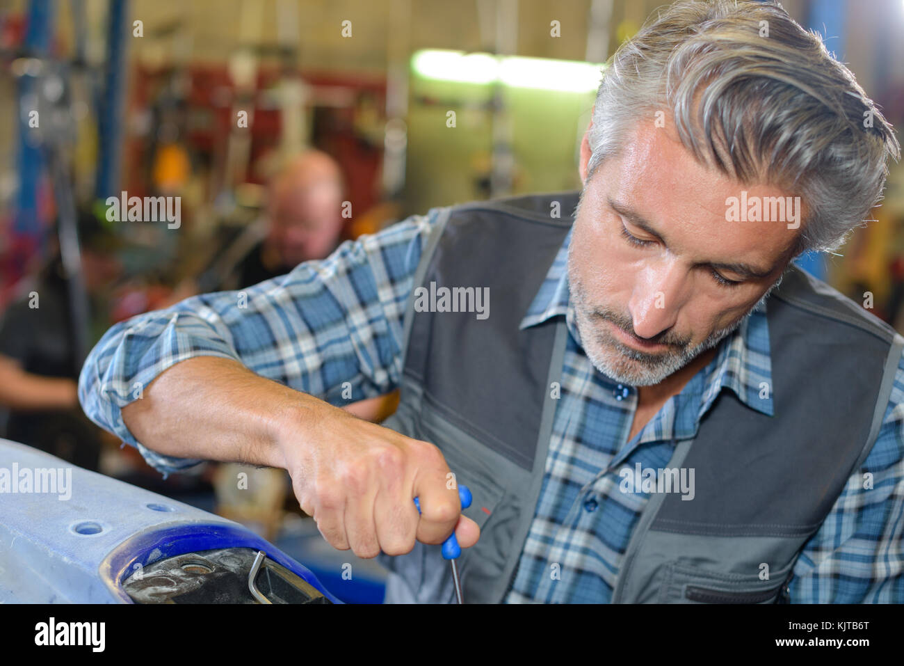 worker fixing something Stock Photo - Alamy
