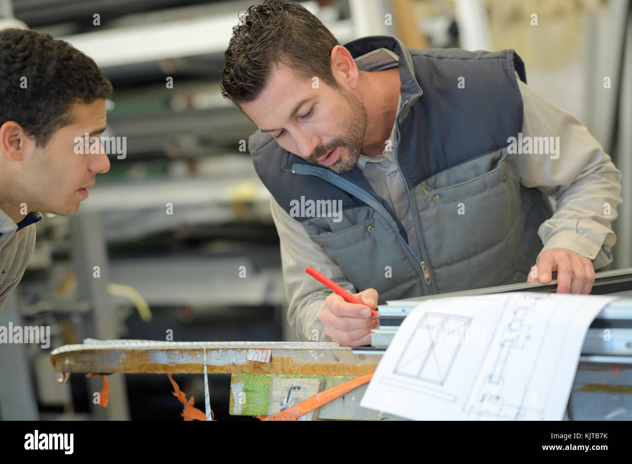 industrial engineer looking at plans Stock Photo - Alamy