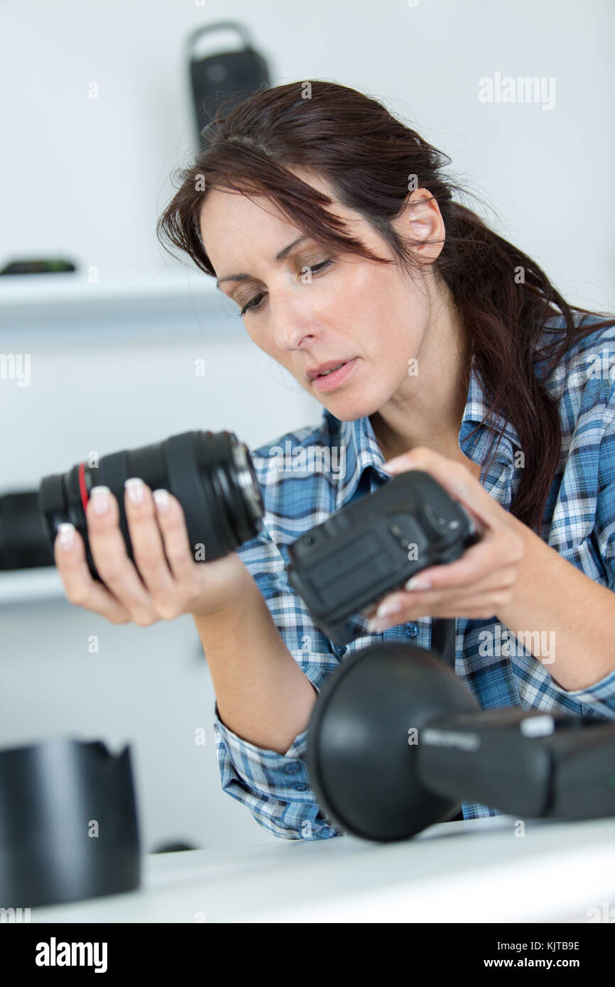 female photographer checking dslr fisheye camera lens Stock Photo - Alamy
