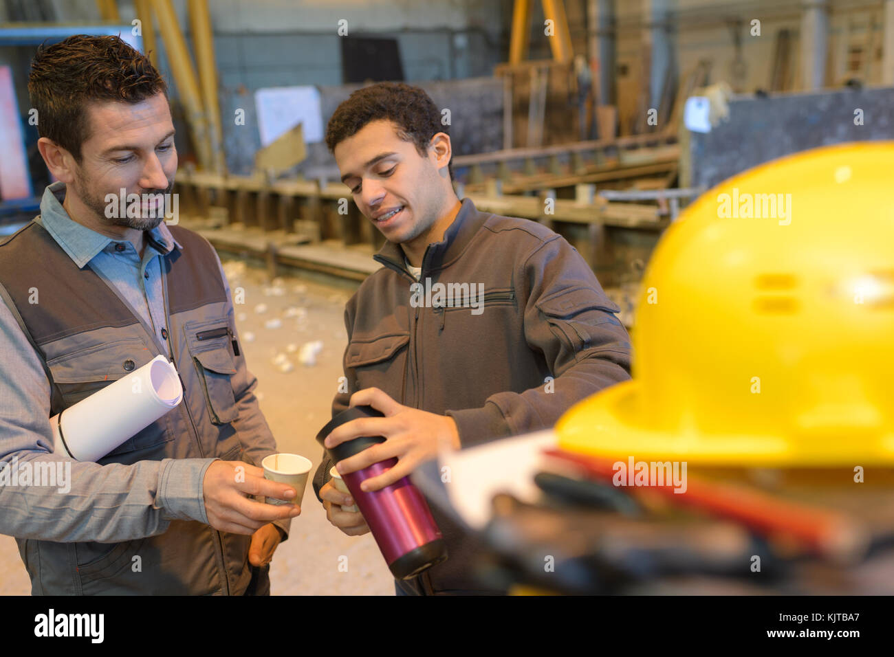workers drinking coffee at warehouse Stock Photo - Alamy