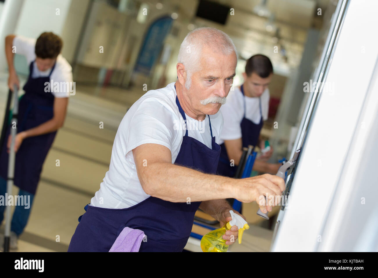 senior housemaker with many cleaning supplies Stock Photo - Alamy