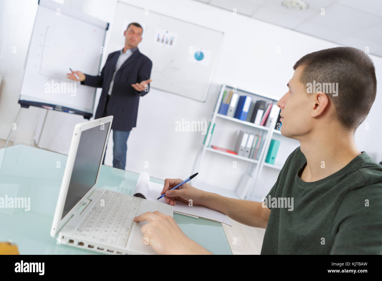 teacher on white board and student in classroom Stock Photo - Alamy
