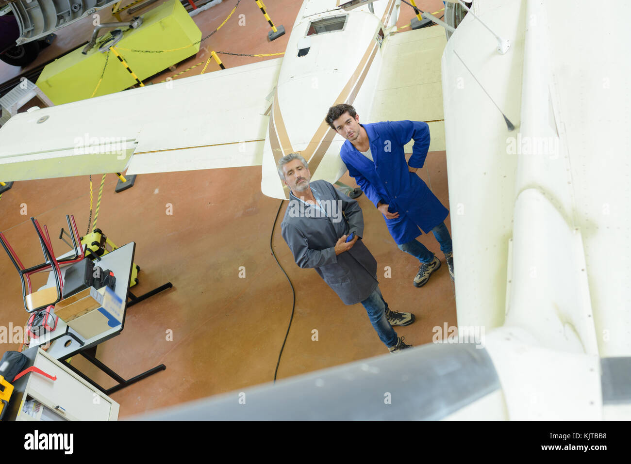 Men looking up at aircraft Stock Photo - Alamy