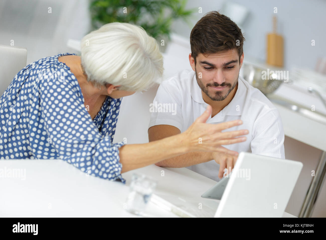 grandmother and boy with laptop Stock Photo - Alamy