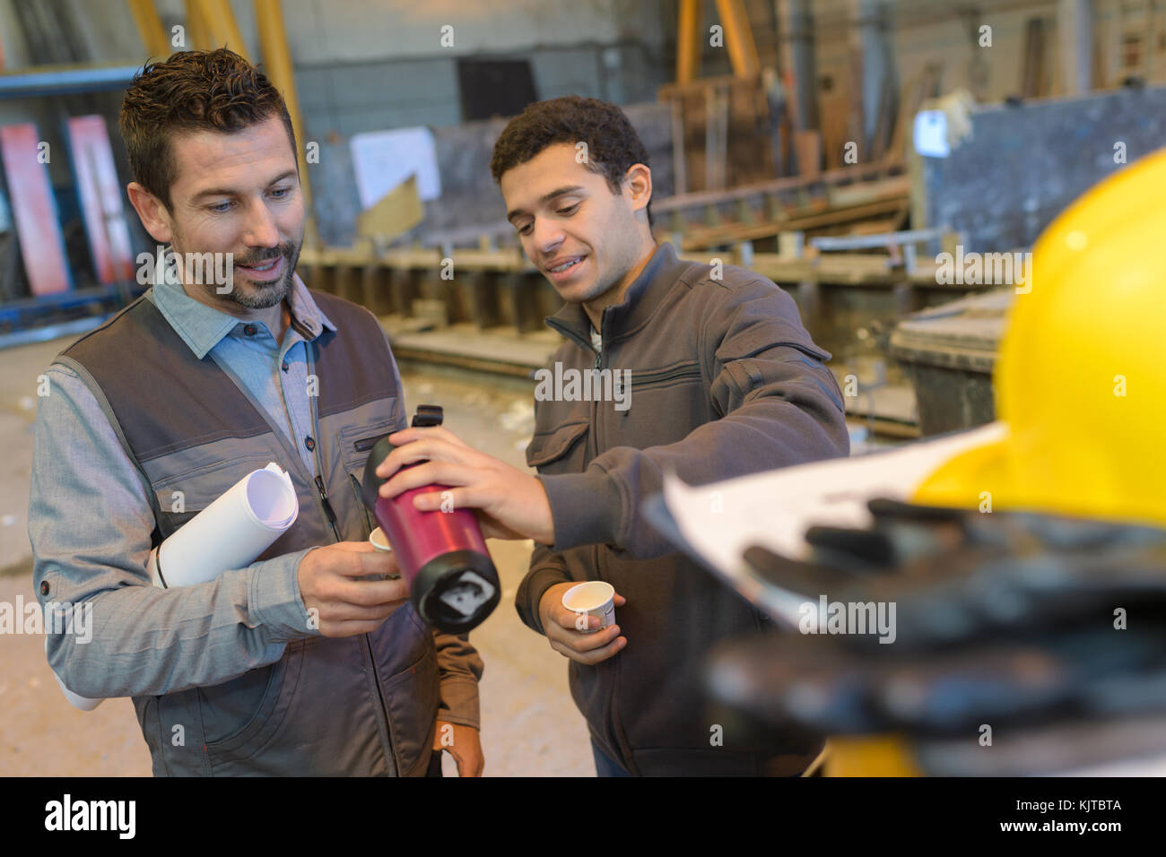 warehouse workers having a break with coffee Stock Photo - Alamy