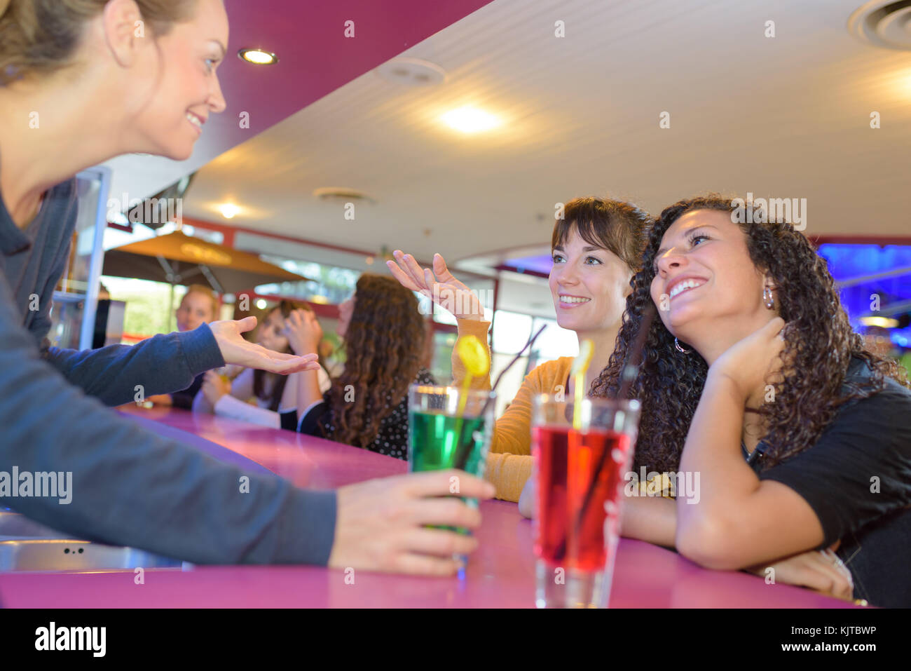 conversation in a bar Stock Photo - Alamy