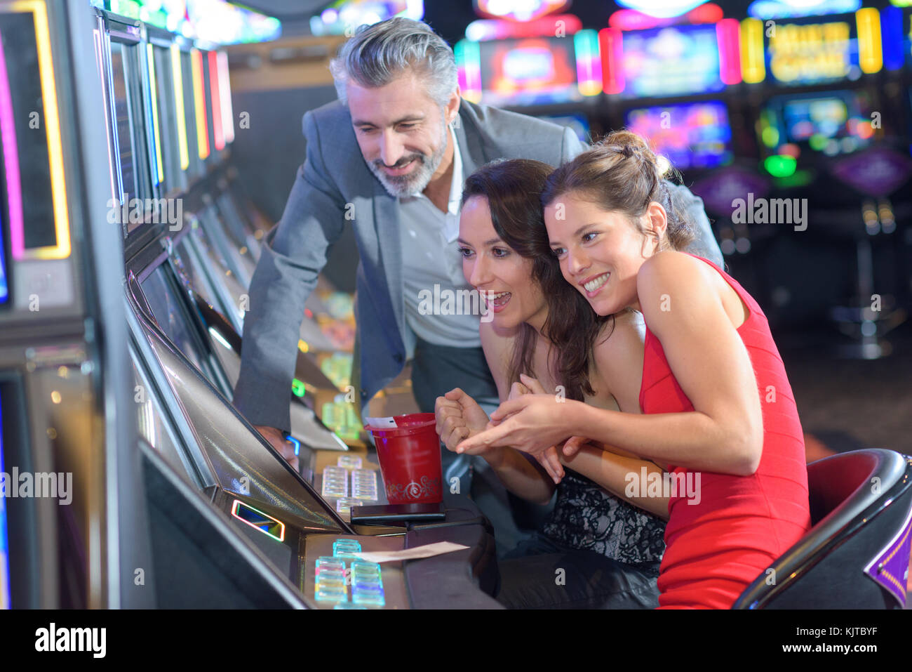 People playing gambling machines in hi-res stock photography and images ...