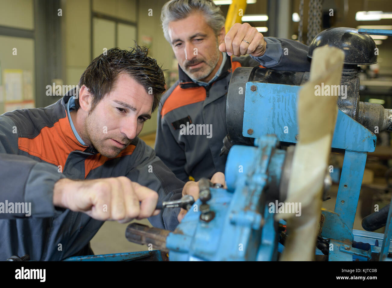 two middle-age engineers in the factory Stock Photo - Alamy