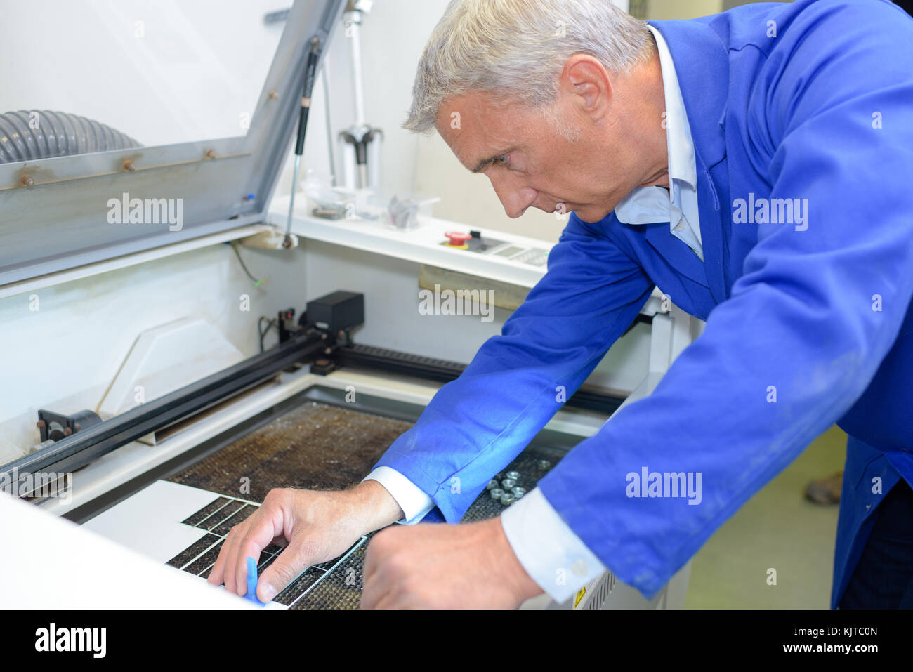 technician fixing machine Stock Photo - Alamy