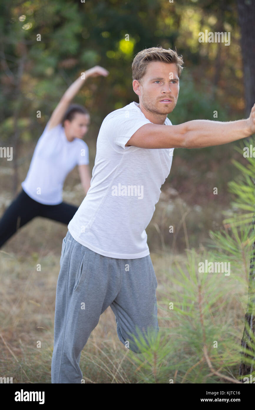 handsome fit man posing outdoors in forest Stock Photo - Alamy