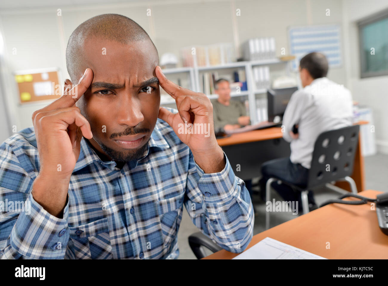 man concentrating in office Stock Photo - Alamy