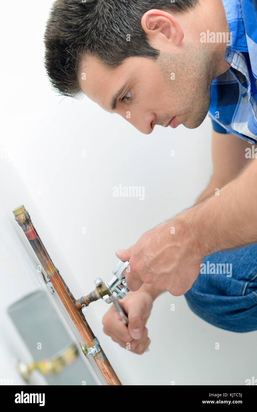 man fixing door Stock Photo - Alamy