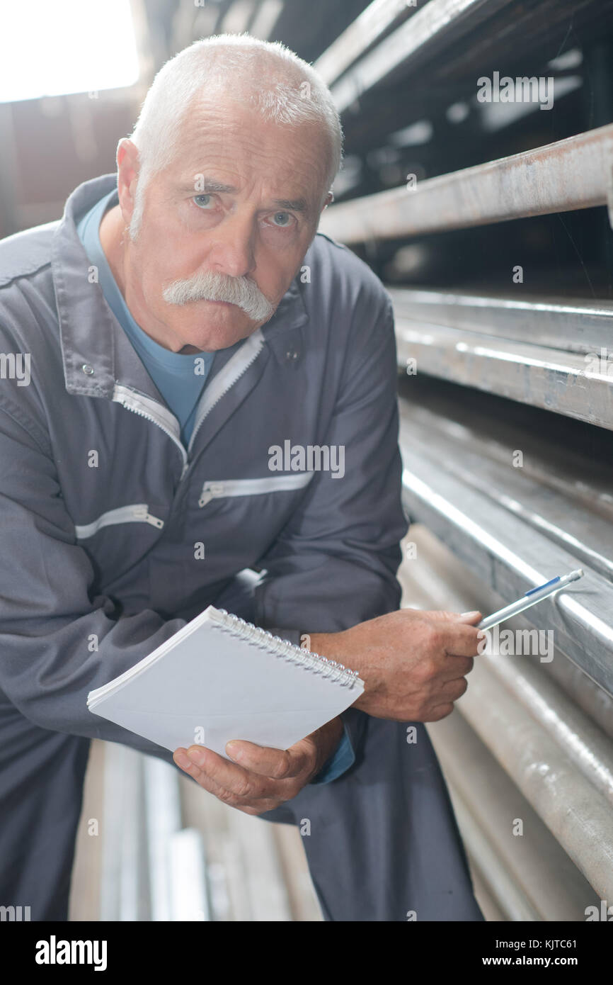 senior operator works at machine Stock Photo - Alamy