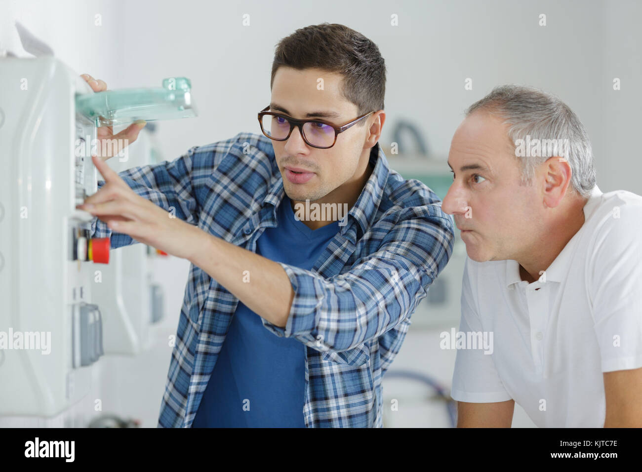 technicians checking robot machine Stock Photo - Alamy