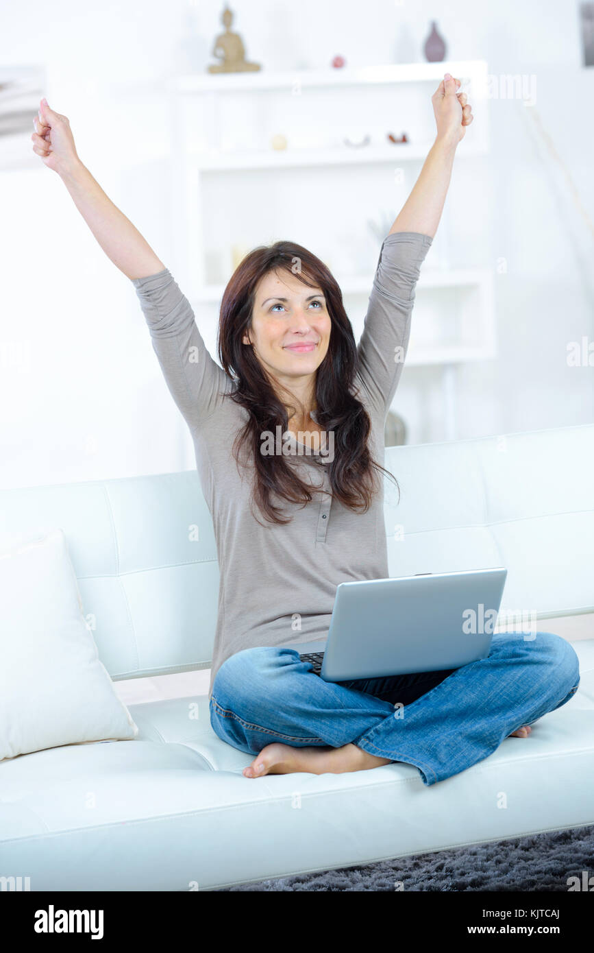 happy woman working at home with a laptop Stock Photo - Alamy