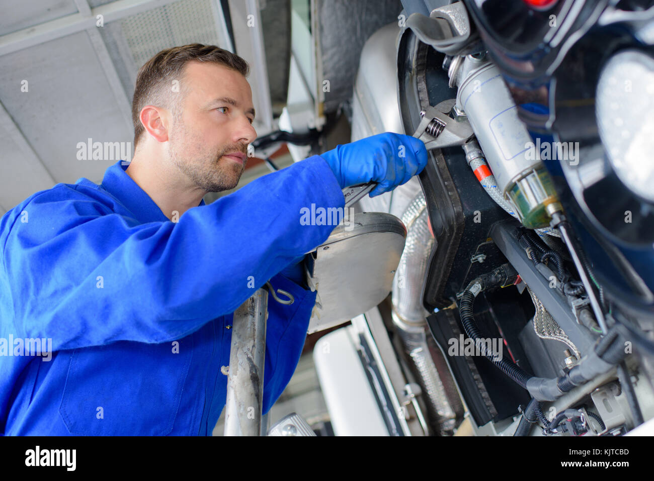 Mechanic using wrench Stock Photo - Alamy