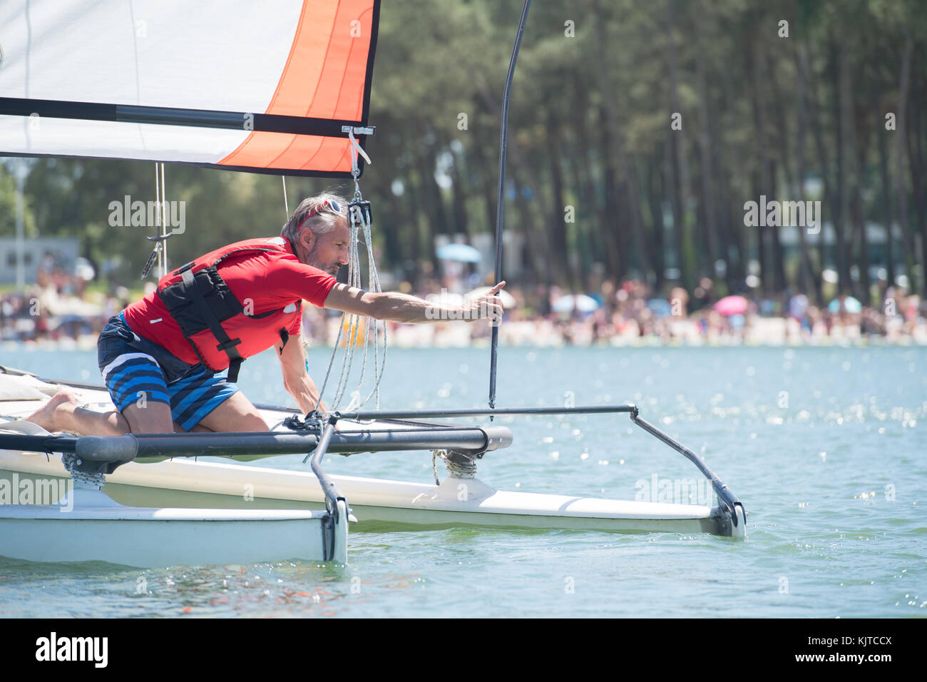 professional waterman training on lake with catamaran Stock Photo - Alamy