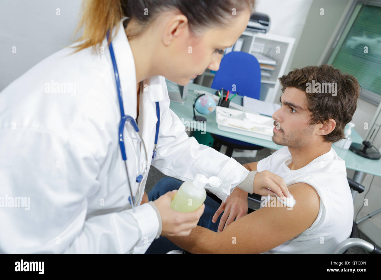 young doctor prepares an injection to a patient Stock Photo - Alamy