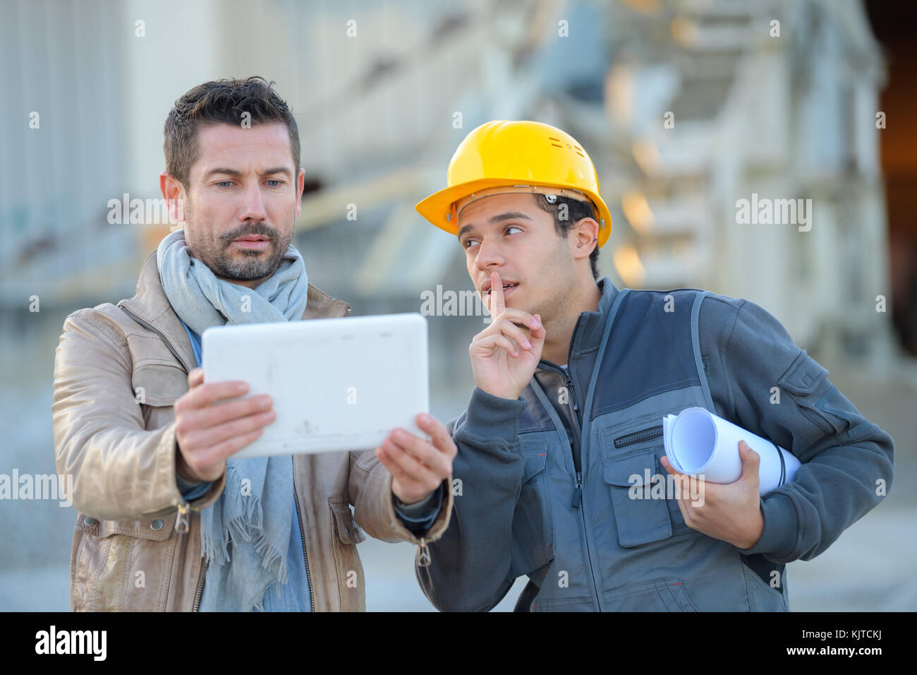 worker making silence gesture Stock Photo - Alamy