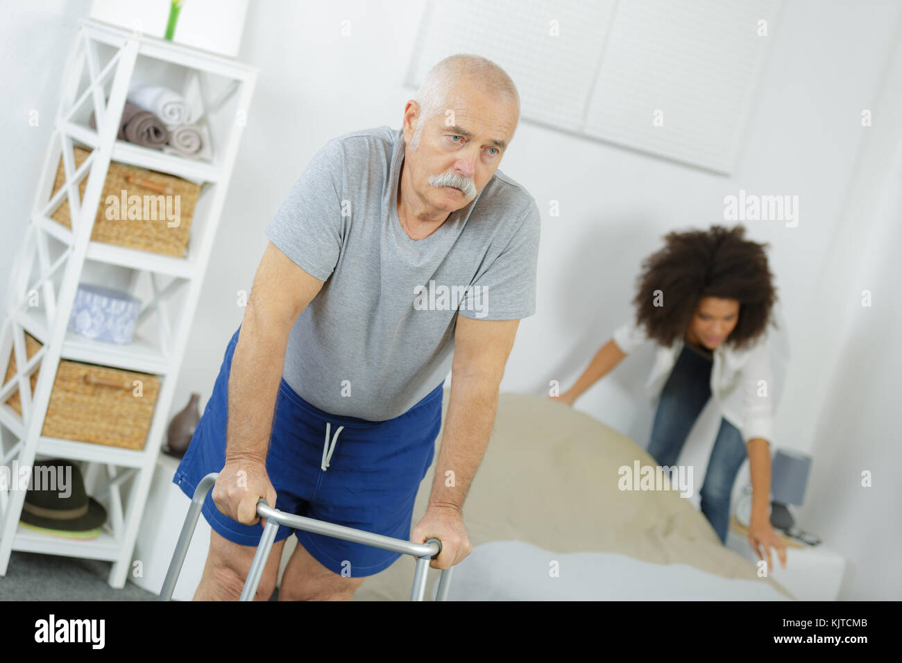 Senior man standing walking frame hi-res stock photography and images ...
