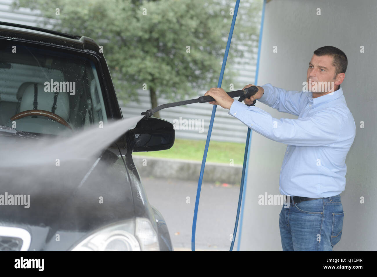 car washing cleaning with foam and hi pressured water Stock Photo - Alamy