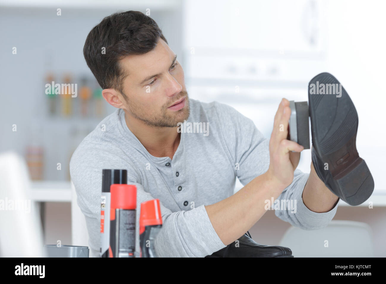Man cleaning shoes hi-res stock photography and images - Alamy