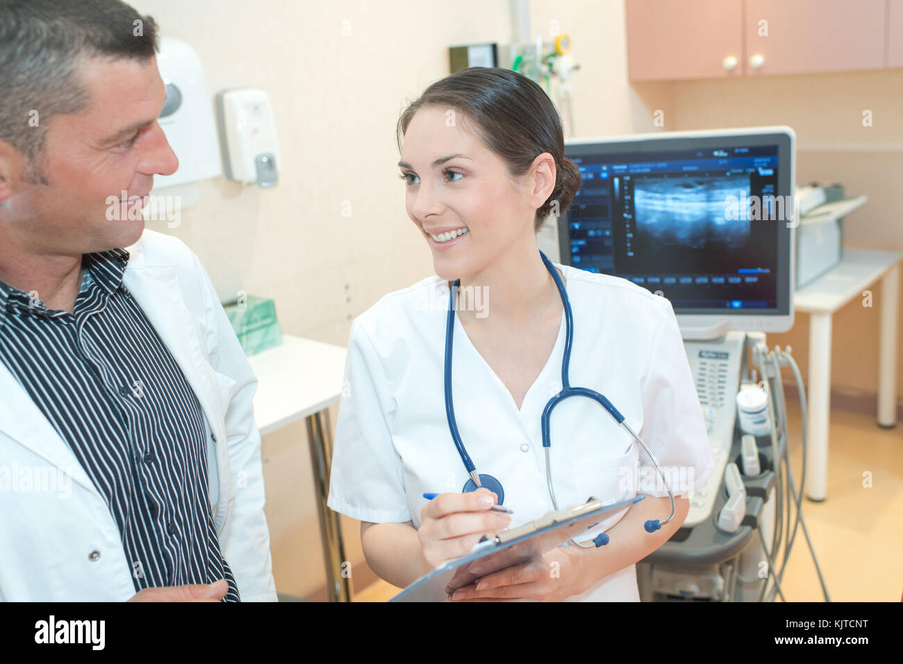 Male doctor flirting female nurse hi-res stock photography and images ...